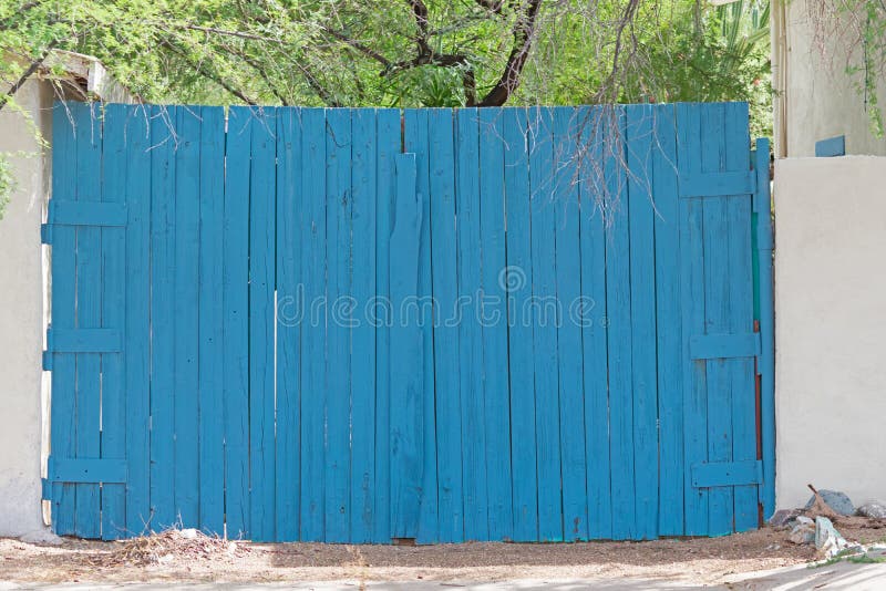 Old Blue Double Door Wooden Gate in a White Wall Stock Photo - Image of ...