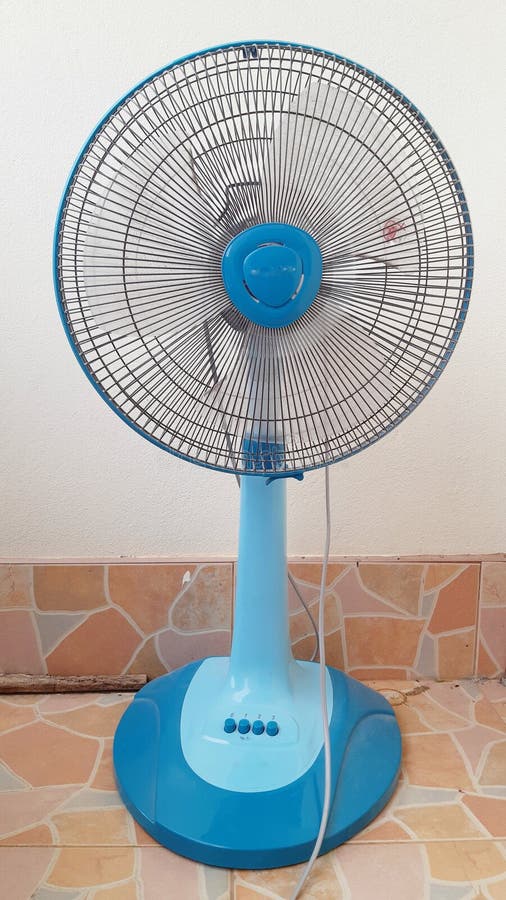 Old Blue Fan on a White Wall. Stock Image - Image of blue, frame: 210362823