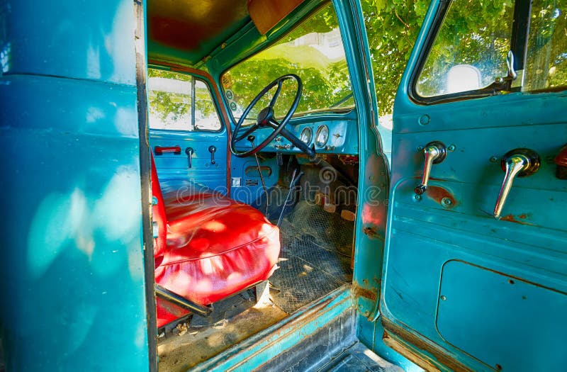 An Old, Blue International Lorry Parked Under an Oak Tree with Mottled ...