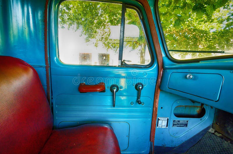 An Old, Blue International Lorry Parked Under an Oak Tree with Mottled ...