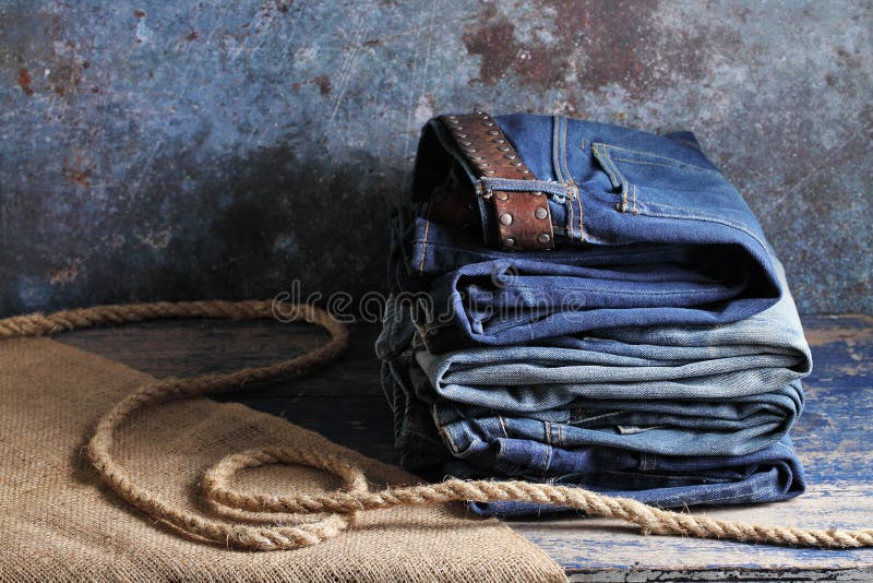 Old Blue Jeans on Rustic Background Stock Image - Image of shade ...