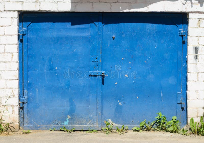Old blue metal garage door stock photo. Image of iron - 94561420