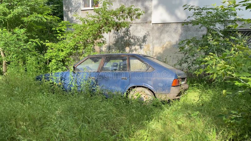 Old Blue Soviet Car Left Neat the House Wall in Bushes Stock Footage ...