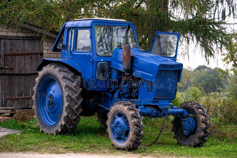 Old Blue Tractor in the Countryside. Stock Image - Image of equipment ...