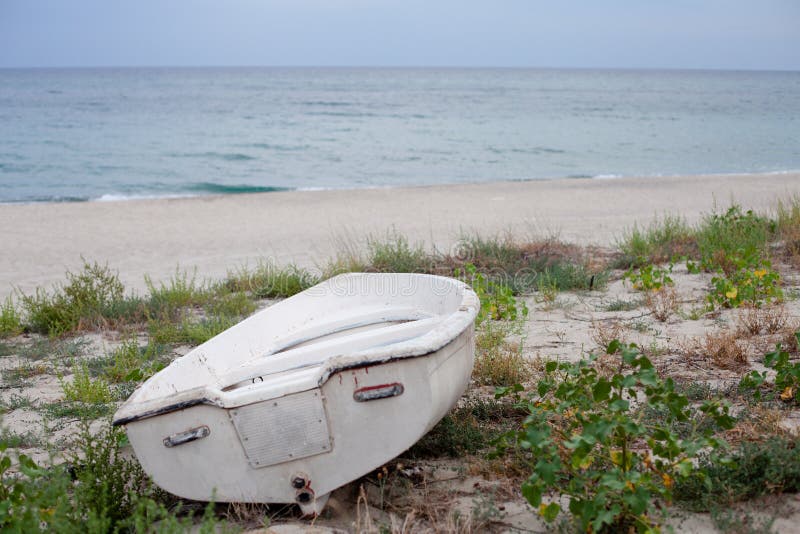 Old boat on a beach stock photo. Image of cloudy, landscape - 170714668