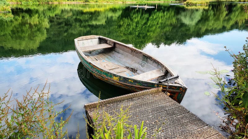 Old boat on lake stock photo. Image of trees, boat, fishing - 125125958