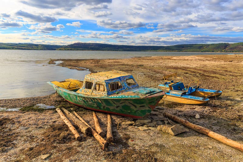 Old boat on lake shore stock image. Image of landscape - 60777953
