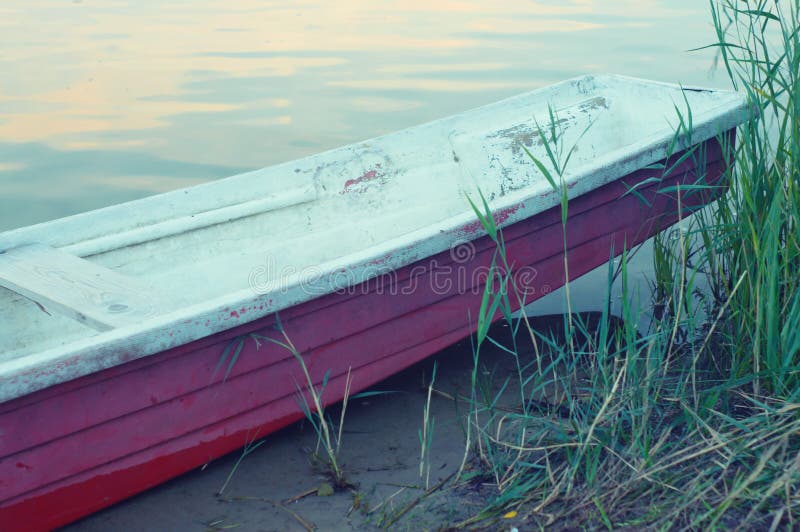 Old Boat Resting on a Lake Shore Stock Image - Image of reflection ...