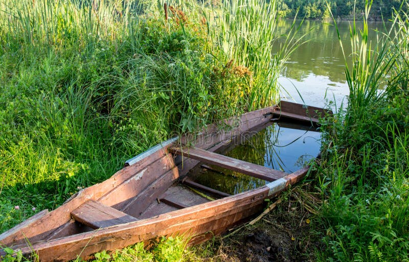 Old boat on river stock image. Image of reflection, teather - 124936937