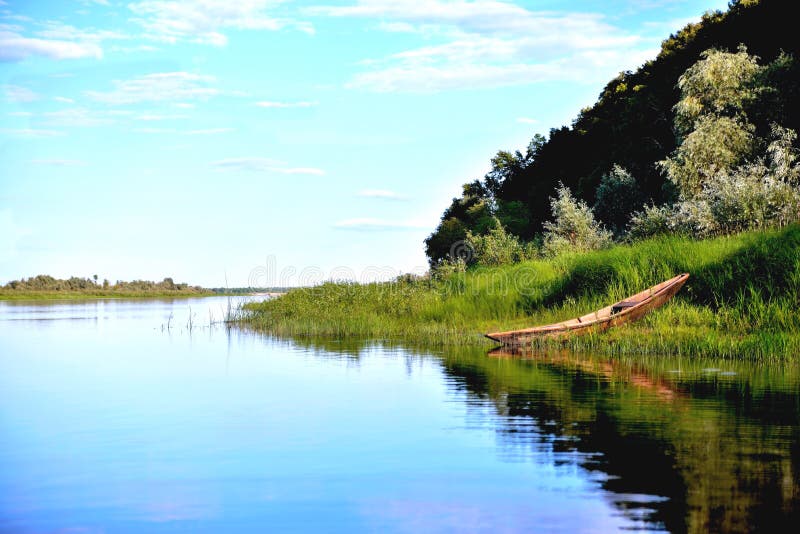 Boat on Riverside stock image. Image of tree, river - 156398789