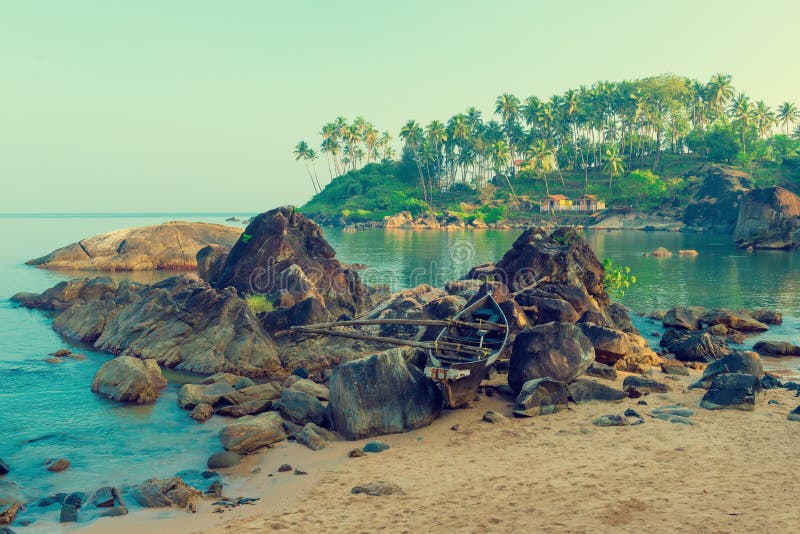 Old Boat in the Rocks at the Beach of Goa. Stock Image - Image of ...