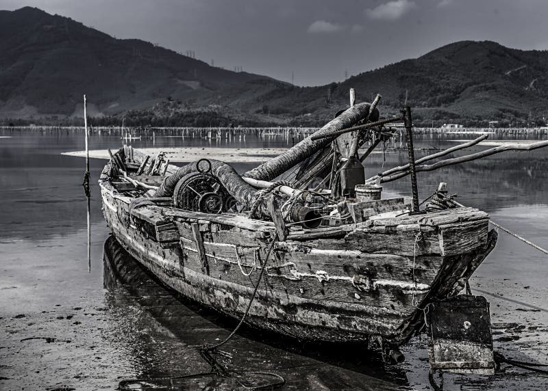 Old Boat in the Sea with Mountains on Background Stock Photo - Image of ...