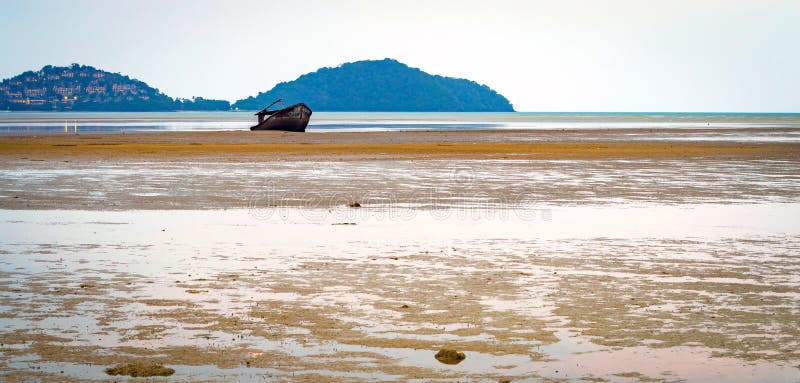 Old Boat Stranded during Low Tide in the Background Stock Image - Image ...