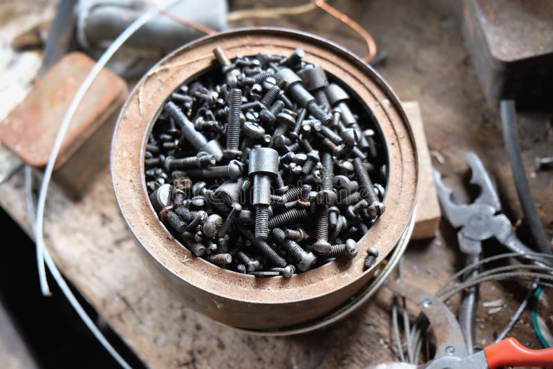 Old Bolts and Screws in a Bucket Stock Photo - Image of engineering ...