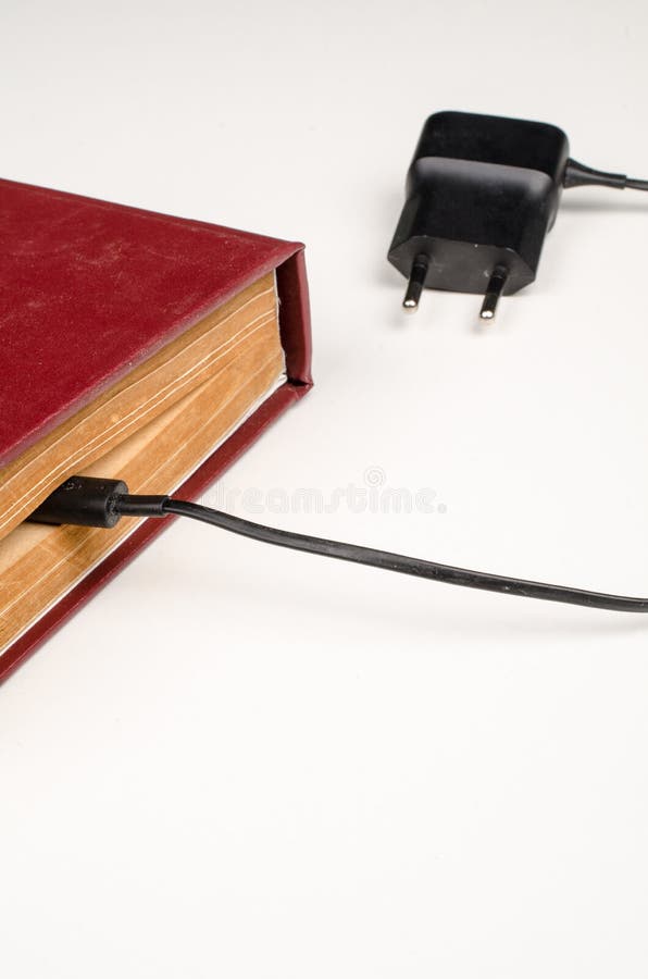 Old Book with a Battery Charging Cable Stock Photo - Image of education ...