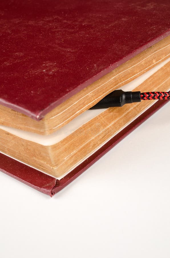 Old Book with a Battery Charging Cable Stock Image - Image of book ...