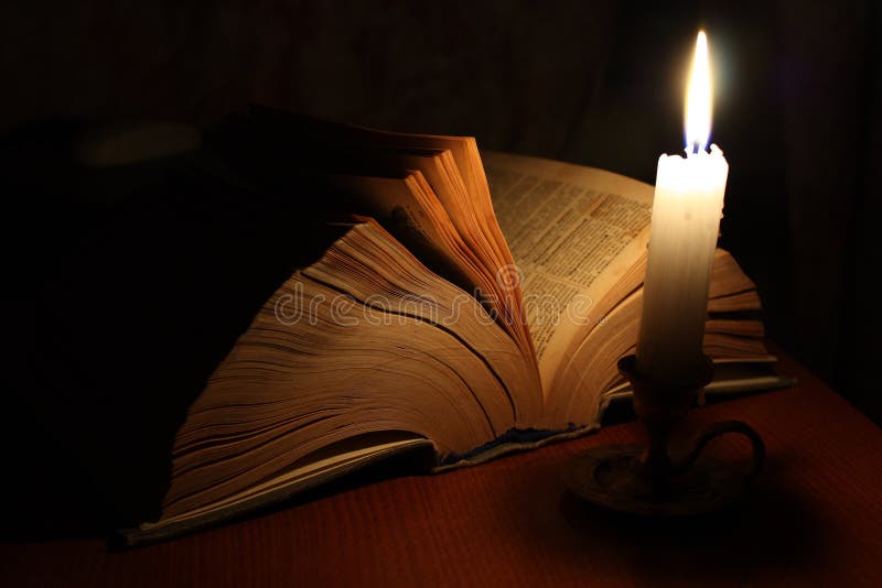 Stack old book and candle. stock photo. Image of history - 20566600