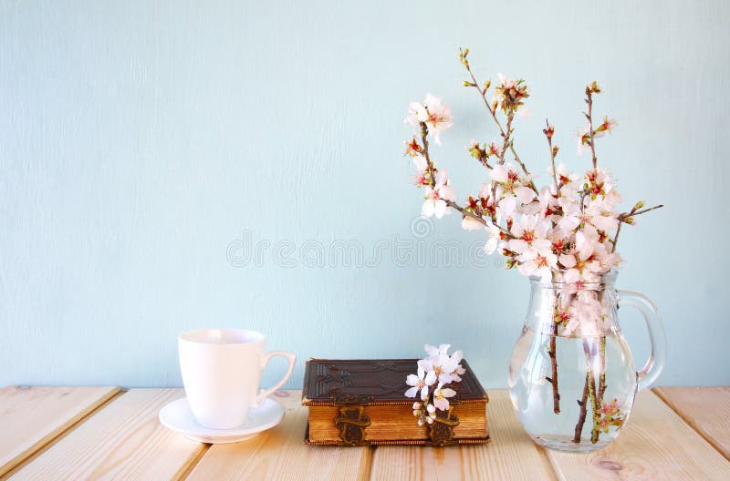 Old Book, Cup of Coffee Next To Spring White Flowers Stock Photo ...