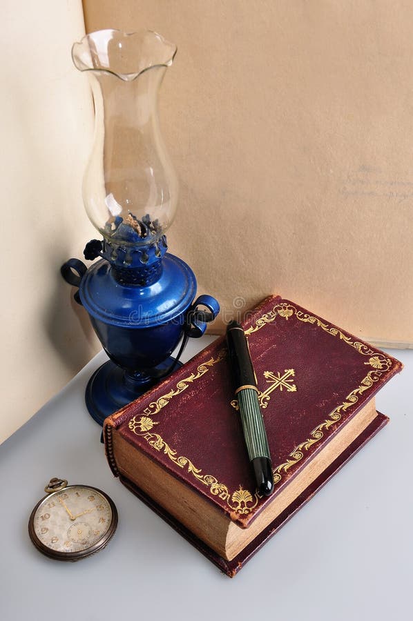 Old book lamp and watch stock image. Image of ancient - 38514565