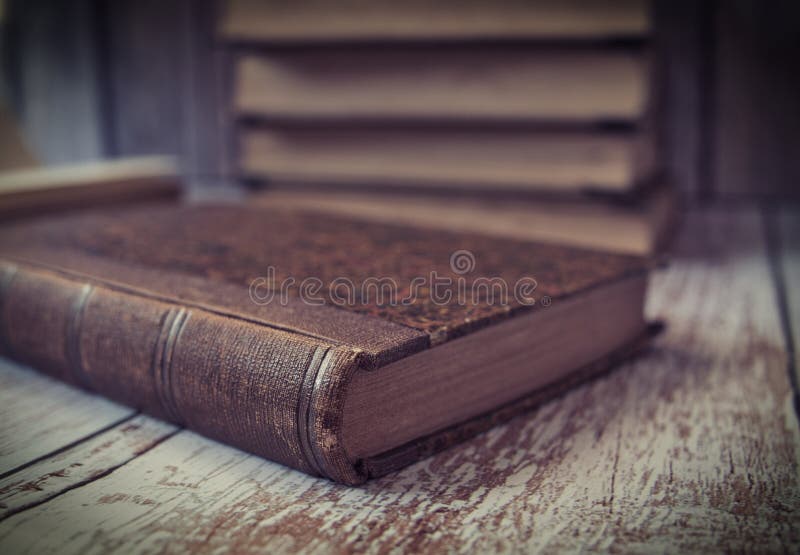 Old book on a wooden table stock image. Image of rustic - 268949871