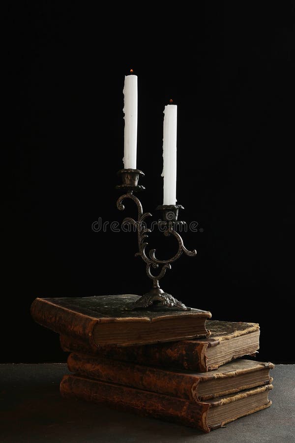 Old Books and an Old Candlestick. Candles in a Tin Candlestick ...