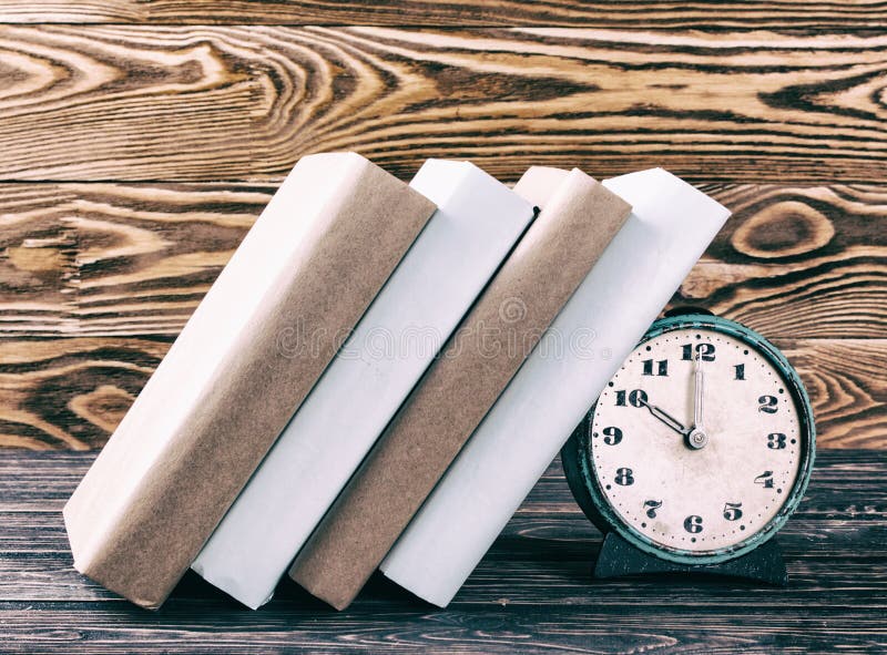 Old books and clock stock image. Image of book, minute - 75496377