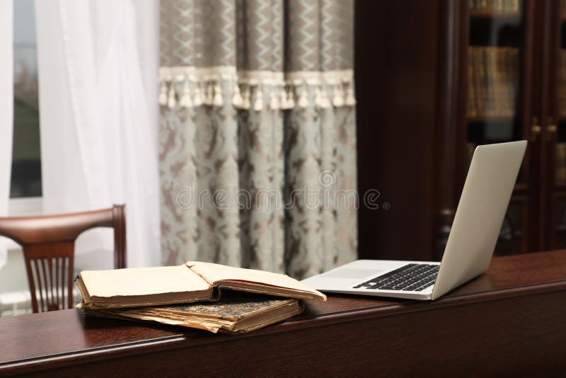 Old Books and Laptop on Wooden Table in Library Reading Room Stock ...