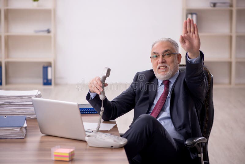 Old Male Boss Working at Workplace Stock Image - Image of salute, desk ...