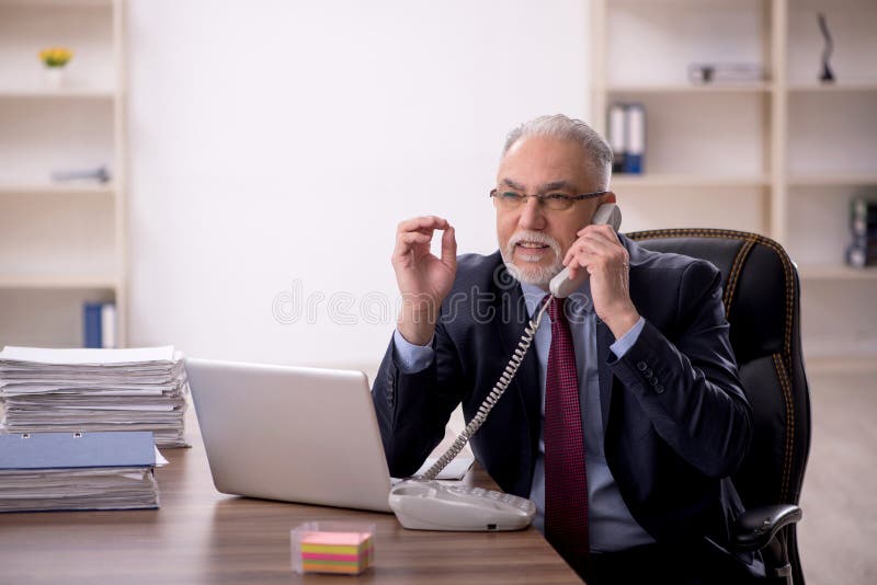 Old Male Boss Working at Workplace Stock Image - Image of workload ...