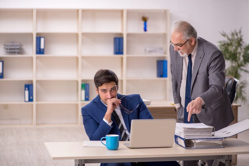 Old Male Boss and Young Male Employee in the Office Stock Image - Image ...