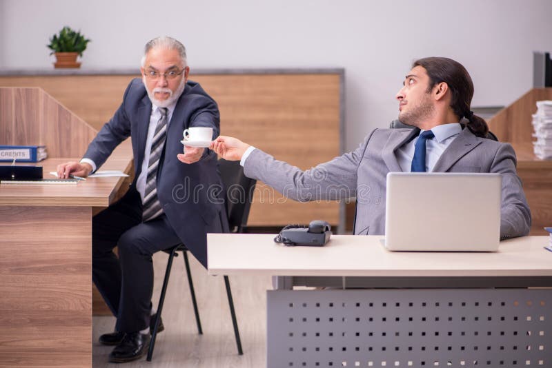 Old Boss and Young Male Assistant in the Office Stock Image - Image of ...