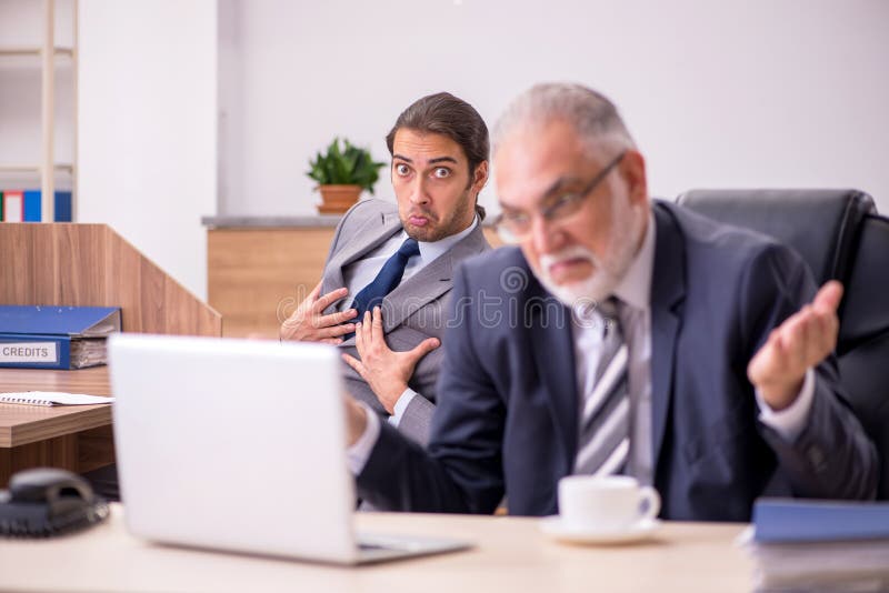 Old Boss and Young Male Assistant in the Office Stock Photo - Image of ...