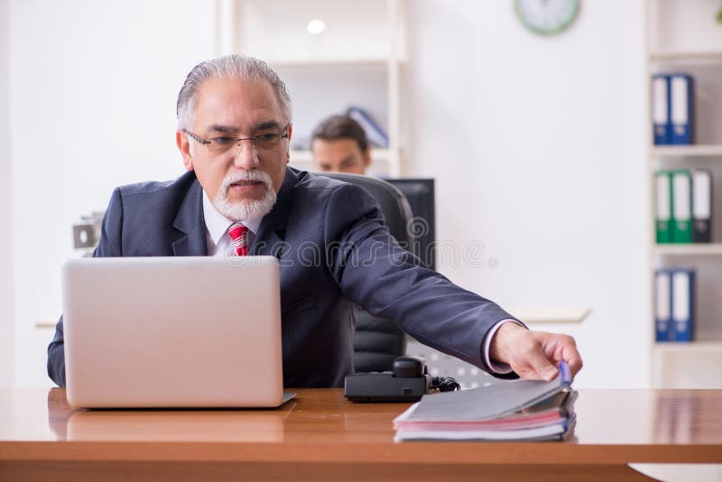 Old Boss and Young Male Employee in the Office Stock Photo - Image of ...