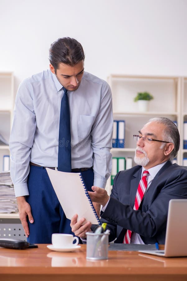 Old Boss and Young Male Employee in the Office Stock Image - Image of ...