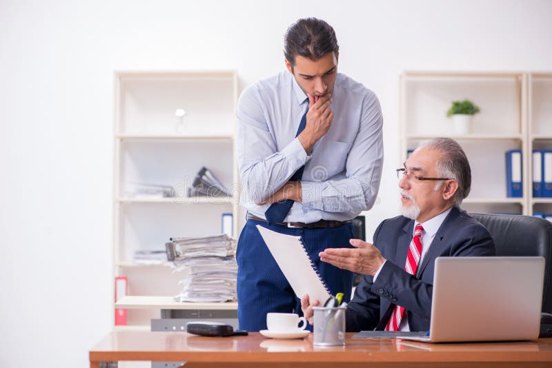 Old Boss and Young Male Employee in the Office Stock Image - Image of ...