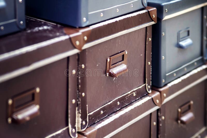 Old Boxes are Stacked on a Shelf. Blurred Image. Soft Focus. Stock ...