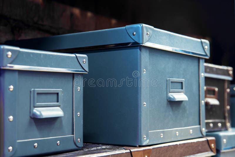 Old Boxes are Stacked on a Shelf. Blurred Image. Soft Focus. Stock ...