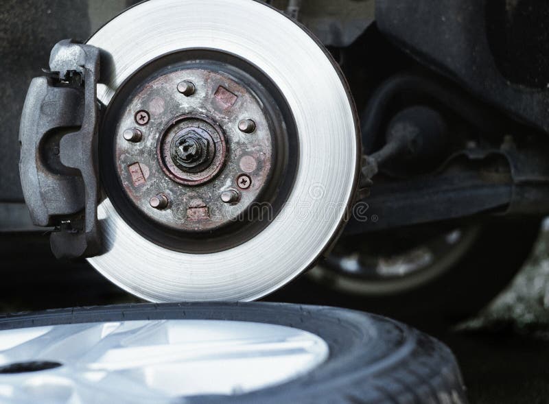 The Old Brake Disc and Caliper Require Service in a Professional ...
