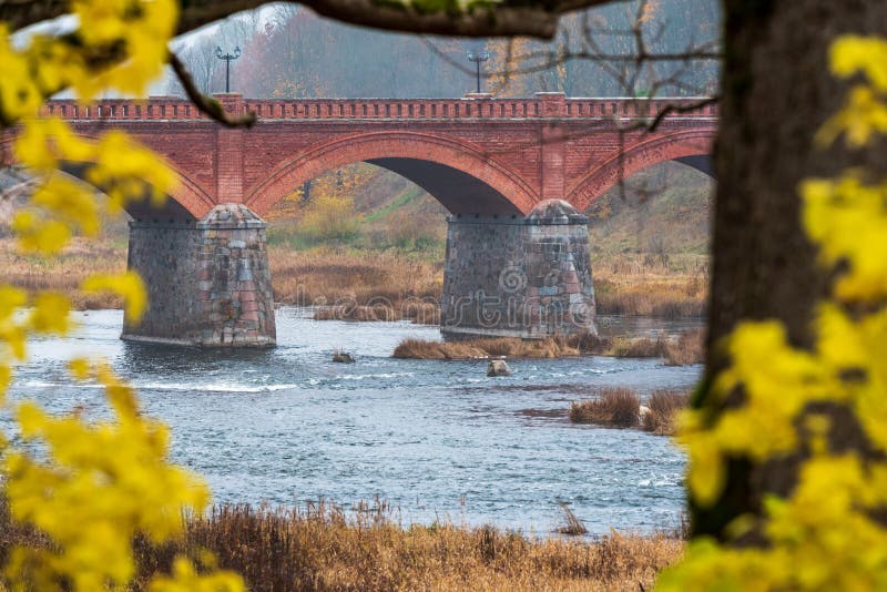 Old brick bridge in autumn stock photo. Image of landmark - 202056314