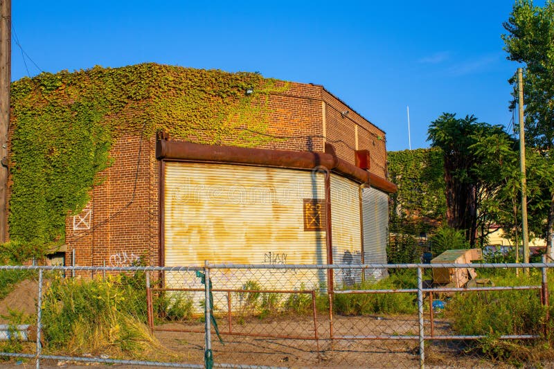 Old Brick Building Behind a Fence Editorial Stock Image - Image of ...