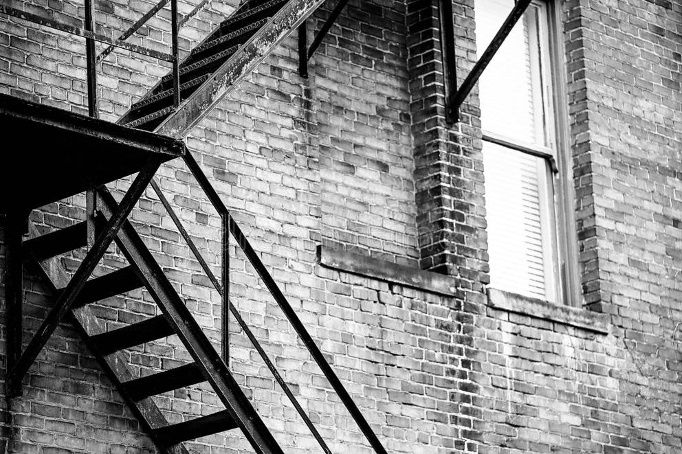 Old Brick Building Exterior in Grayscale Stock Photo - Image of antique ...