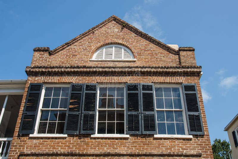 Three Windows with Black Shutters in Old Brick Stock Image - Image of ...