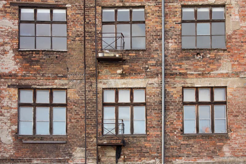 Facade of an Old Brick Building in Loft Style. High Windows and ...