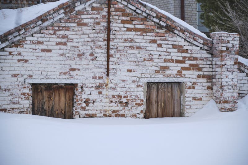 Old Brick House is Covered with Snow Up Very Doors. Stock Photo - Image ...