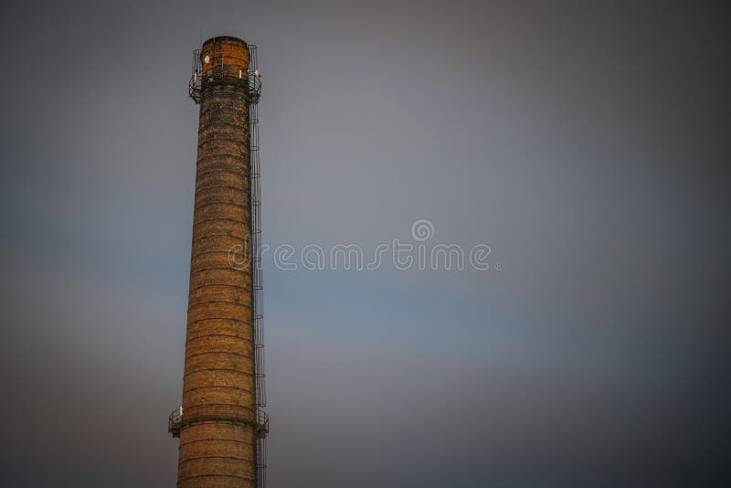 Old Brick Industrial Chimney in the Dark. a Chimney of the Soviet Era ...