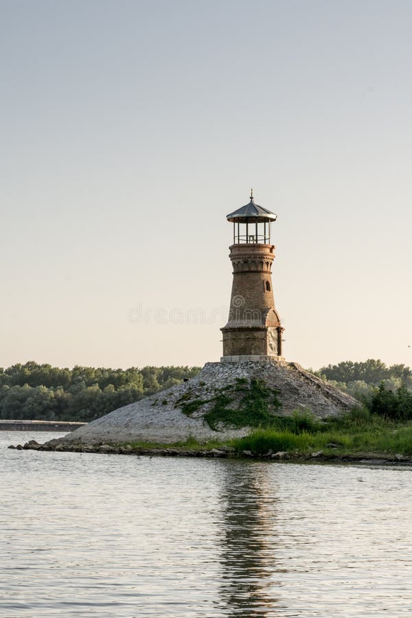 Old Brick Lighthouse on the River with Clear Sky Stock Image - Image of ...