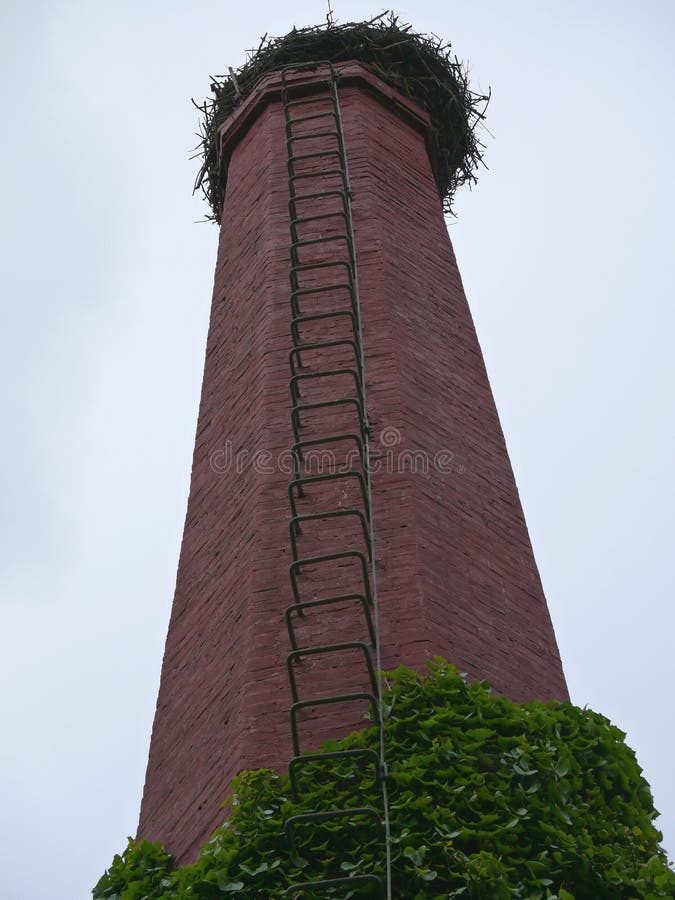 Old Brick Smokestack with Ladder and Stork Nest Stock Image - Image of ...