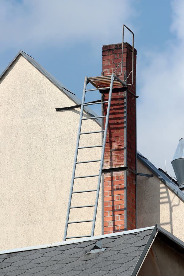 Old Brick Smokestack on a Rooftop with a Metal Ladder for Servicing ...