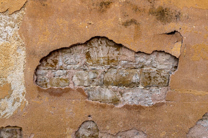 Old Brick Wall with Crumbling Yellow Plaster Stock Photo - Image of ...