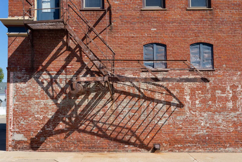Old Brick Wall and Fire Escape Stock Photo - Image of faded, midwest ...